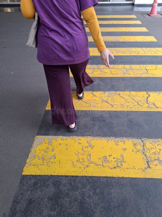 A Lady Walking on a Zebra Crossing Stock Image - Image of zebra, lady ...