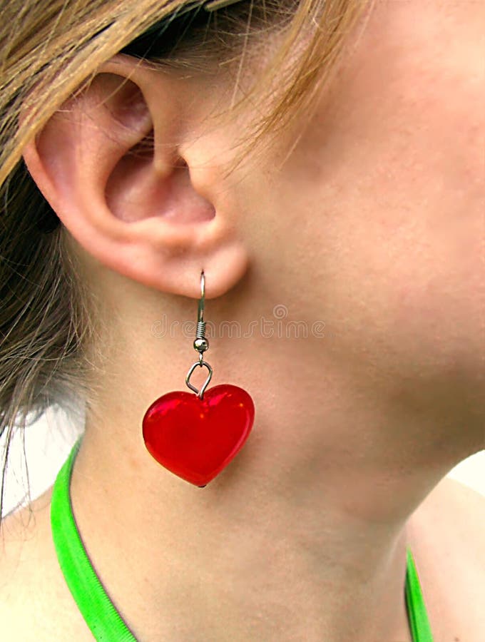 Lady wearing heart earring stock image. Image of vertical - 2423269