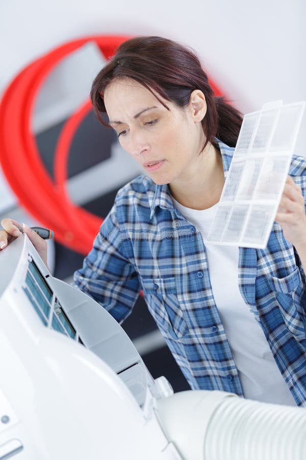 Lady Working on Air Conditioning Unit Stock Image - Image of equipment ...