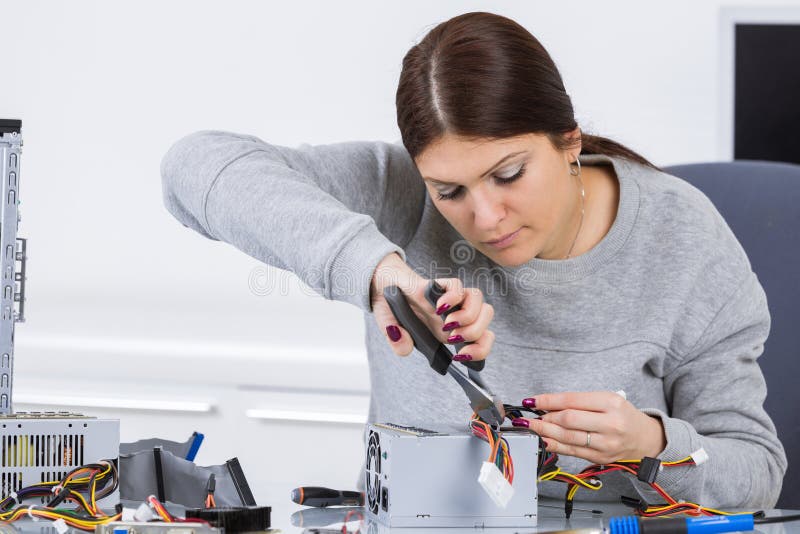 Lady Working on Computer with Pliers Stock Photo - Image of cables ...