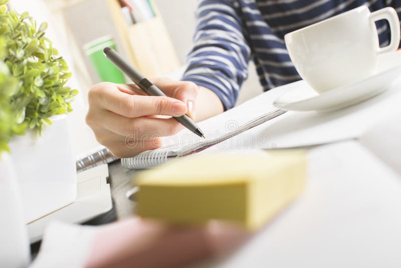 Lady writing in notepad stock photo. Image of office - 83158628