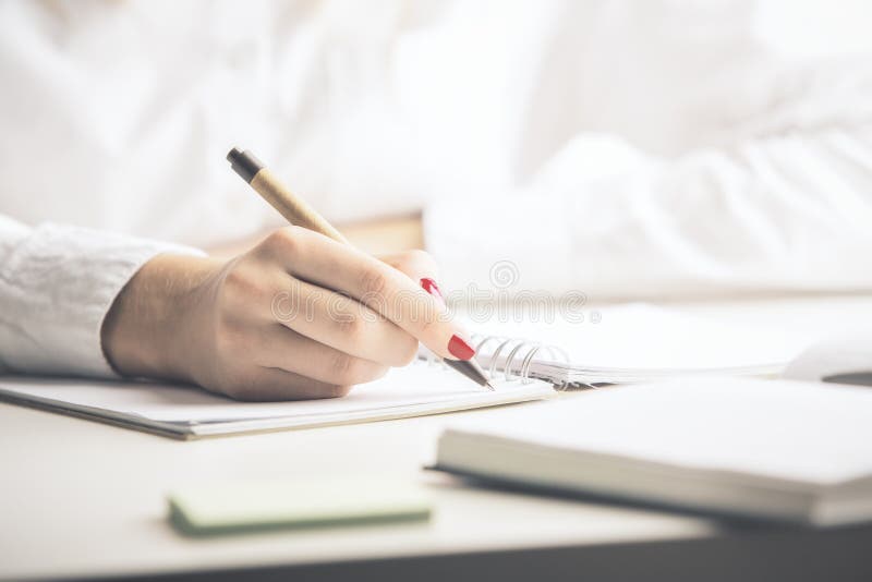 Lady writing in notepad stock photo. Image of office - 83158628