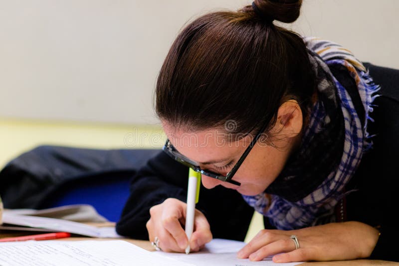 A Lady Writing Notes at a Desk Stock Photo - Image of friend ...