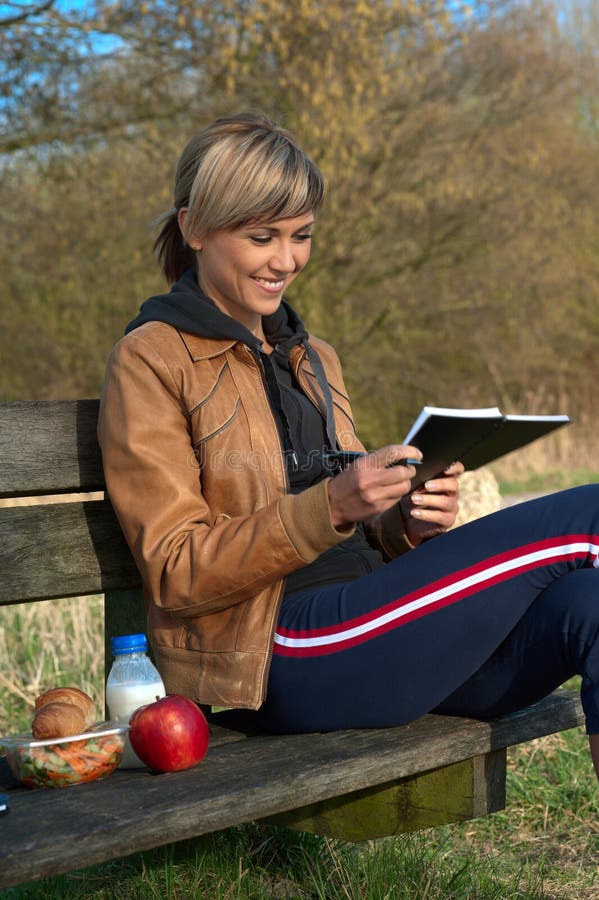 Lady Writing Outdoors stock photo. Image of creative, female - 9981350