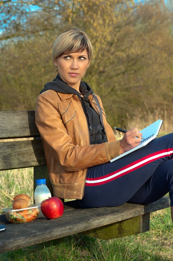 Lady Writing Outdoors stock image. Image of inspiration - 9981463