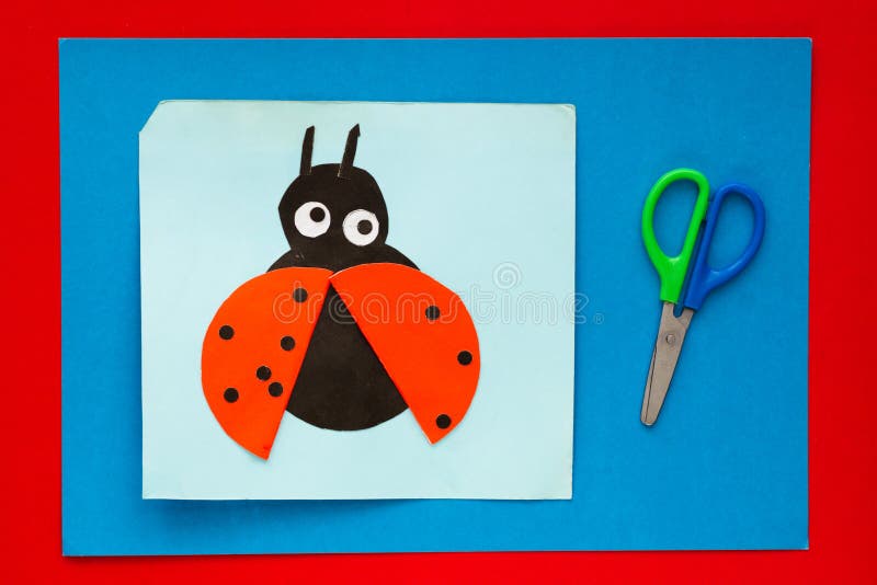 Ladybug Made from Paper by Child on Multicolor Sheets Background Stock ...