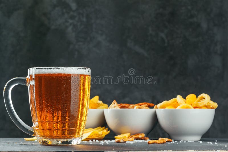 Lager Beer and Snacks on Stone Table. Cracker, Chips Side View Stock ...