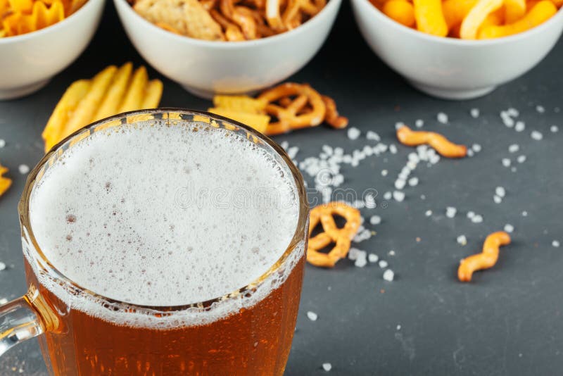 Lager Beer and Snacks on Stone Table. Cracker, Chips Side View ...
