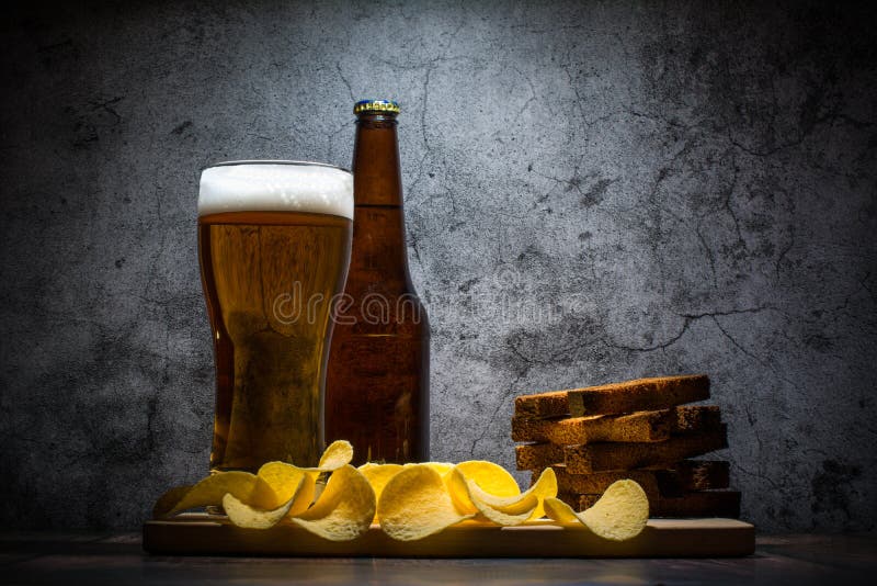 Lager Beer and Snacks on Stone Table. Cracker, Chips Side View Stock ...