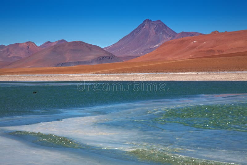Lagoon Quepiaco and Volcano Acamarachi, Chile Stock Photo - Image of ...