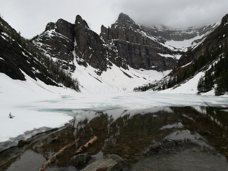 Lake Agnes stock image. Image of snow, mountain, spring - 117356587