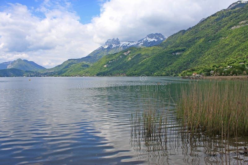 Lake Annecy stock image. Image of lake, beach, mountains - 36123921