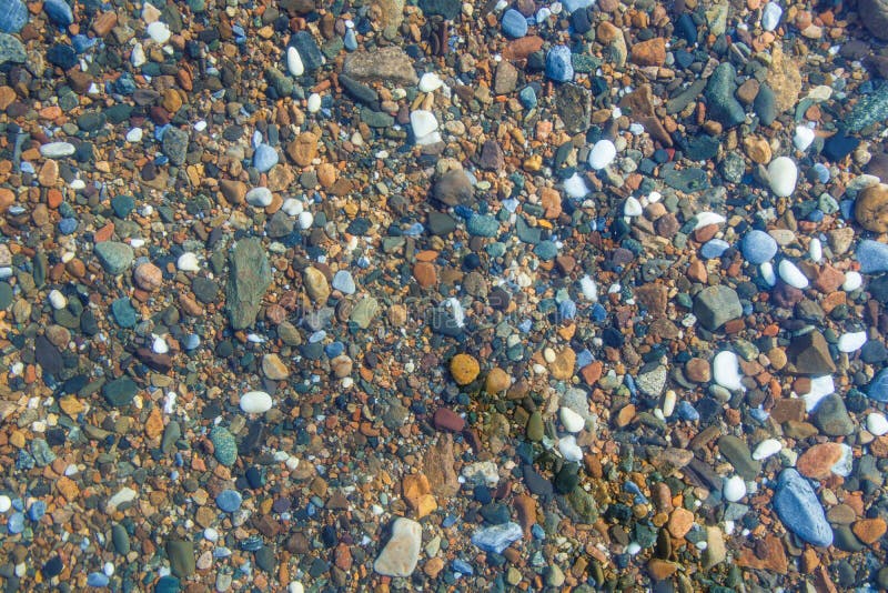 On Lake Baikal, through Clear Water, Small Colored Stones are Visible ...