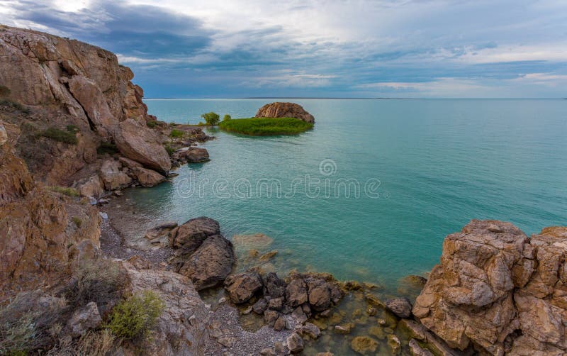 Lake with beautiful rocks stock image. Image of beach - 127181175