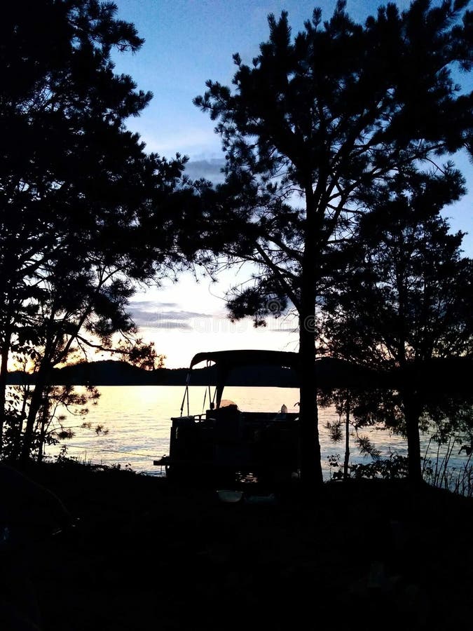 Lake camping on boat stock image. Image of reflection - 212432455