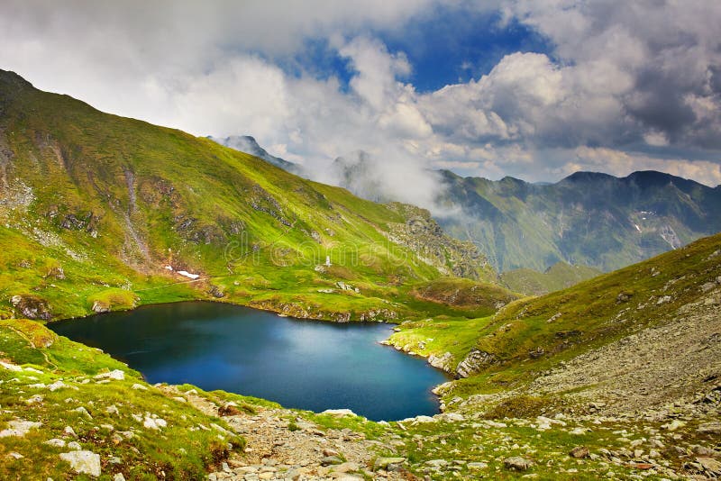 Lake Capra in Romania stock image. Image of clarity, cloudy - 36655783