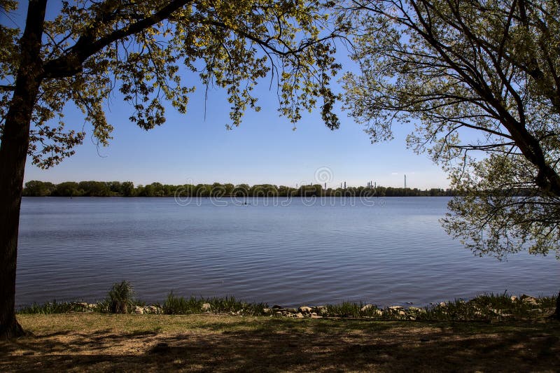 Lake on a Clear Day in Spring Framed by Trees Stock Photo - Image of ...