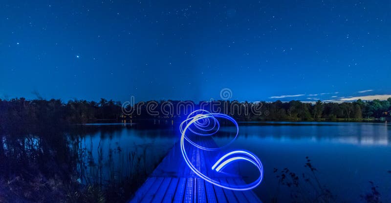 Lake dock at night stock photo. Image of stars, space - 100426004