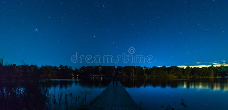 Lake dock at night stock photo. Image of stars, space - 100426004