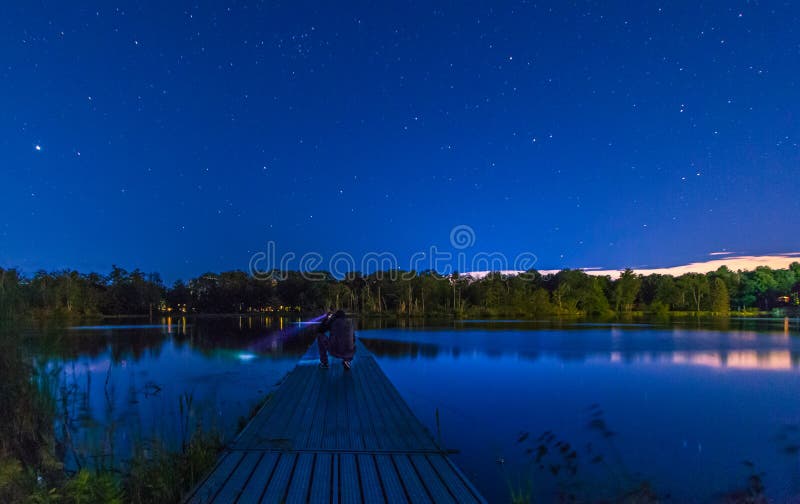 Lake dock at night stock image. Image of scenery, lake - 100426065