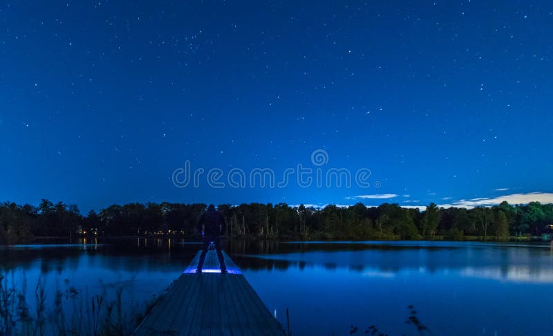 Lake dock at night stock photo. Image of stars, space - 100426004
