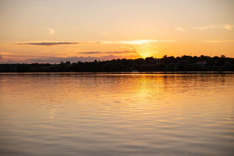 Lake Gleaming Under the Beautiful, Shining Yellow Sunset Stock Photo ...