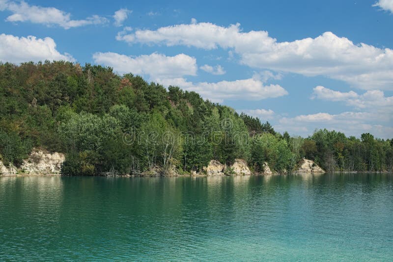 Lake with Green Water and Hill with Trees Stock Image - Image of ...