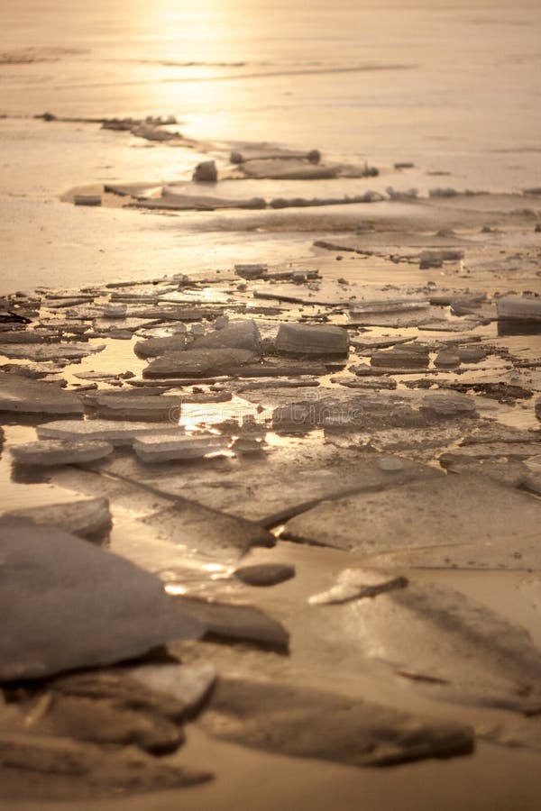 A Lake with Ice and Ice in it and the Sun Reflecting on the Water Stock ...