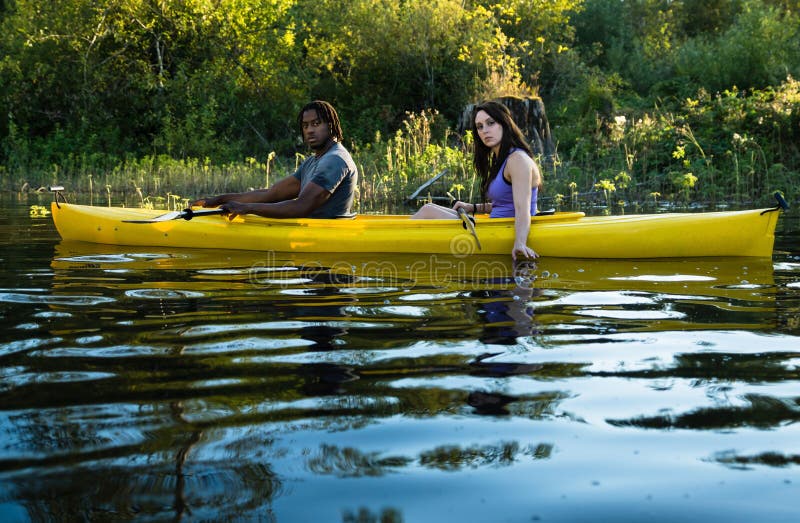 Lake Kayaking Couple stock photo. Image of boat, male - 27130118