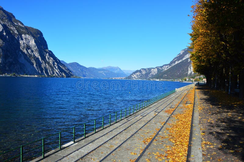 Lake Lecco in fall, Italy stock image. Image of flag - 83890699
