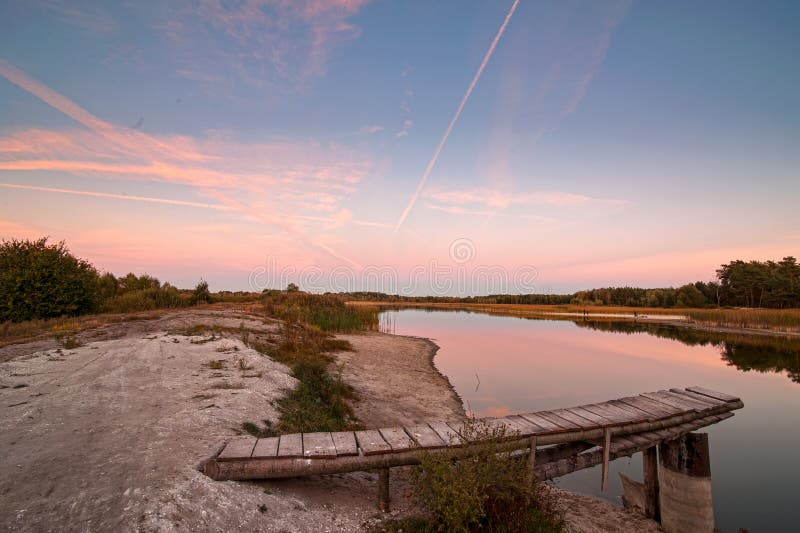 Lake with Masonry on the Sandy Shore View at Evening Stock Photo ...