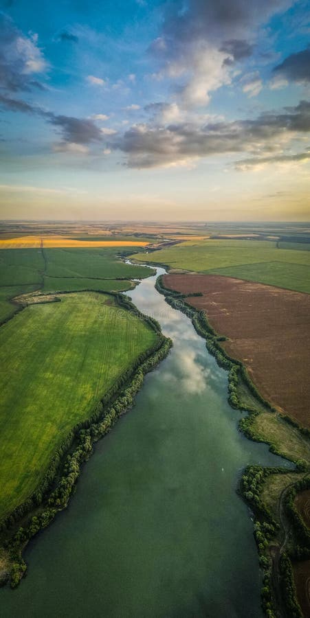 The Lake in the Middle of Endless Green Fields Stock Image - Image of ...