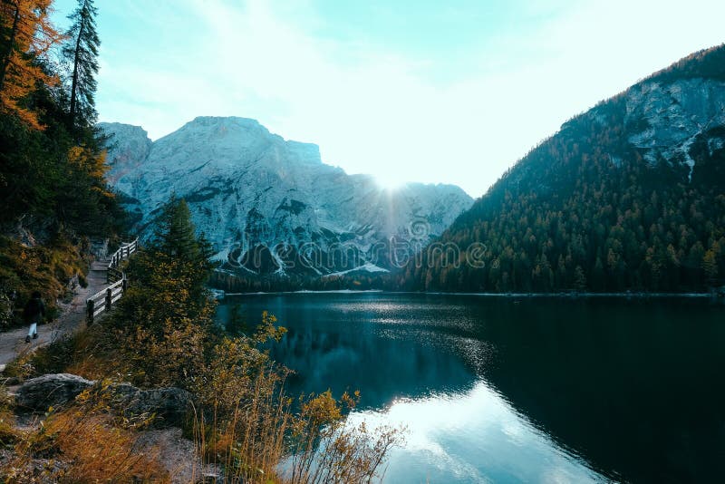 Lake in the Middle of a Snowy and Tree Covered Mountain with a Pathway ...