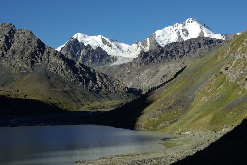 The lake and mountains stock photo. Image of water, issyk - 24947072