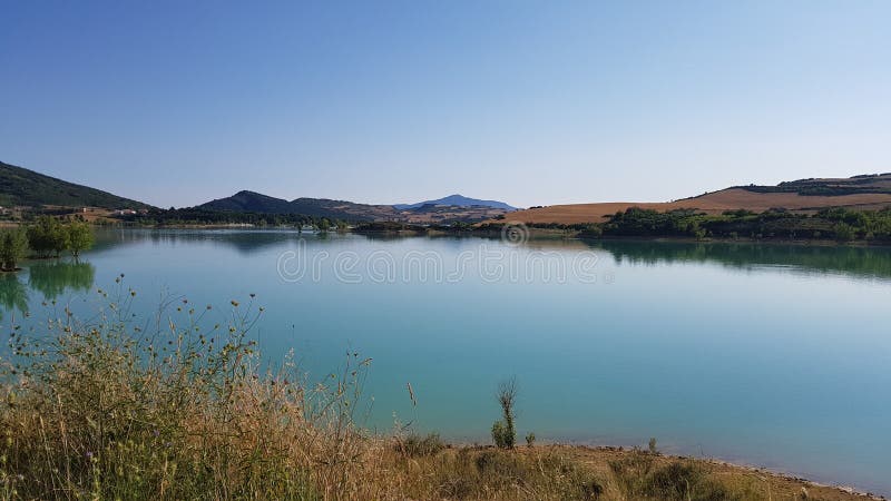 Lake between Mountains with Blue Water and Blue Sky in Spain Stock ...