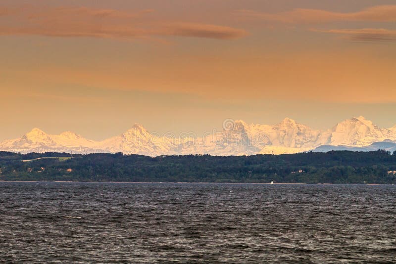 Lake Neuchatel and Alps stock image. Image of scenery - 24828171