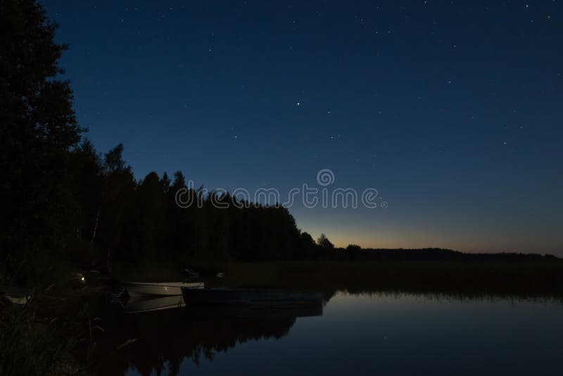 Deep Blue Lake at Night with Beaming Stars Stock Photo - Image of ...