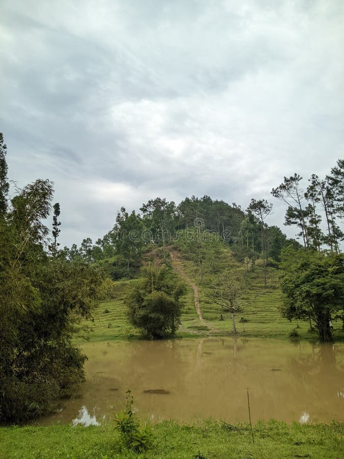 A Lake on a Peak with Brown Water Color and with a Calm Atmosphere ...