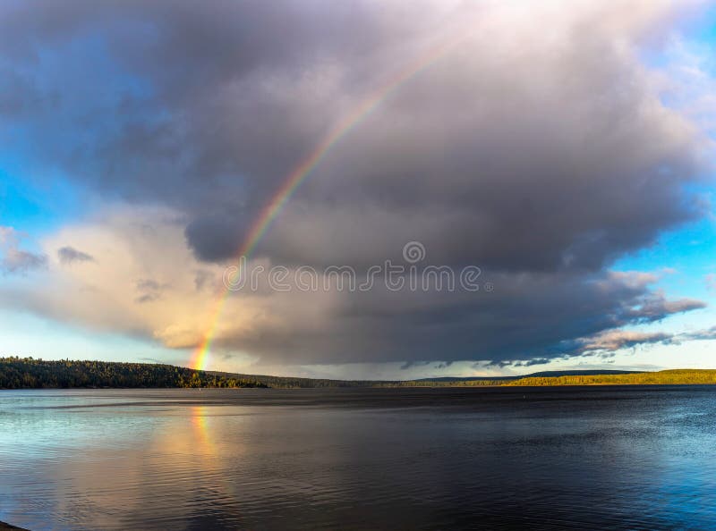 Lake after Rain with a Rainbow Over it on a Summer Evening Stock Photo ...