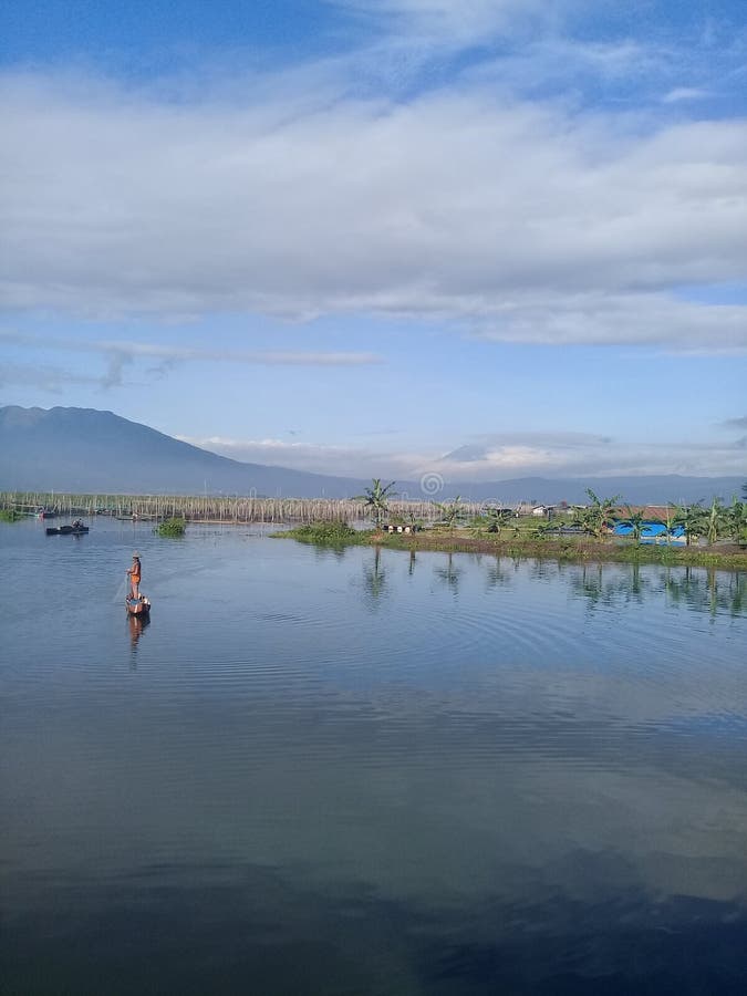 Lake Rawa pening Blue sy stock image. Image of green - 256564487