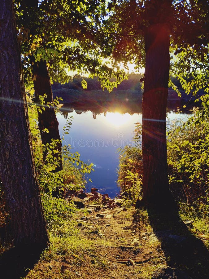 Lake in the Rays of the Setting Sun on an Autumn Day. Stock Photo ...