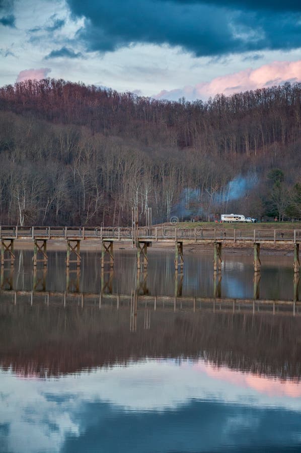 Lake Reflection At Sunset With Pier Dock Foot Path Stock Image - Image ...