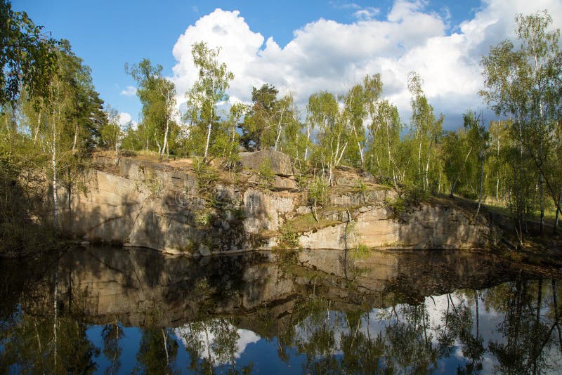 Lake with a Rock Wall and Birch Forest Stock Image - Image of beautiful ...