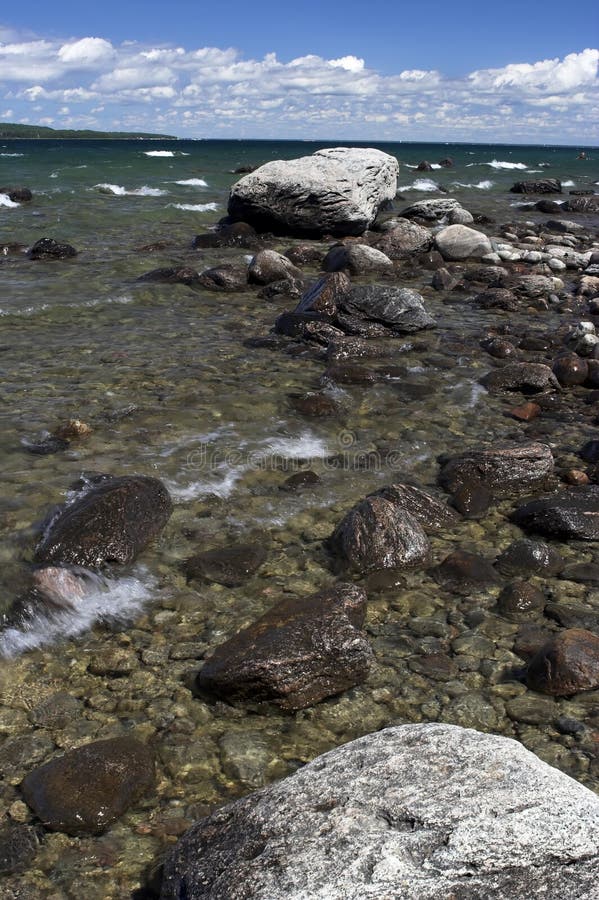 Lake shore with stones stock photo. Image of shore, michigan - 1651692