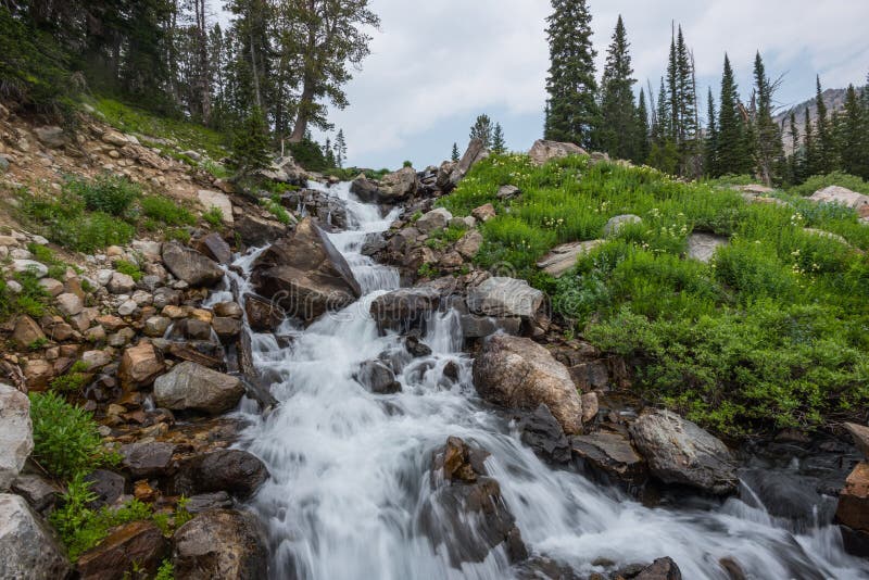 Lake Solitude Empties into Cascade Creek Stock Image - Image of ...