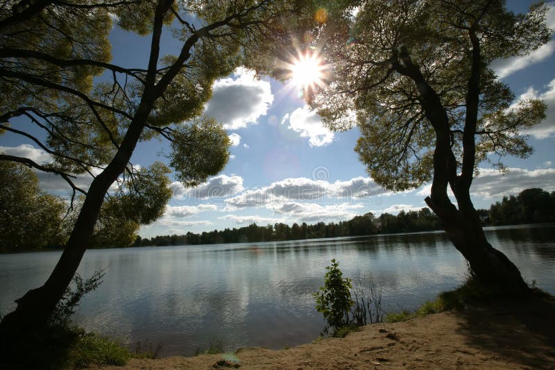 Lake and sun. stock photo. Image of forest, tree, clouds - 243414