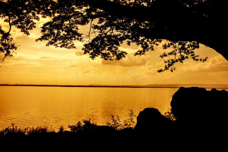 Lake in the Sun Breaks through Evening Stock Image - Image of outdoors ...