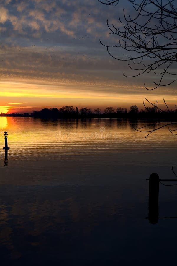 Lake at Sunset with the Sky Casted in the Water Seen from the Shore ...