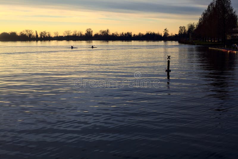 Lake at Sunset with the Sky Casted in the Water Seen from the Shore ...