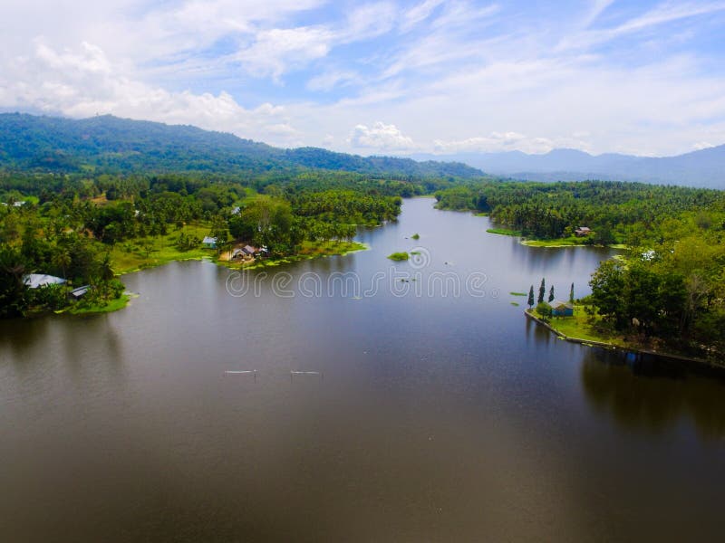 The Lake is Surrounded by Mountains and Green Plains Stock Image ...